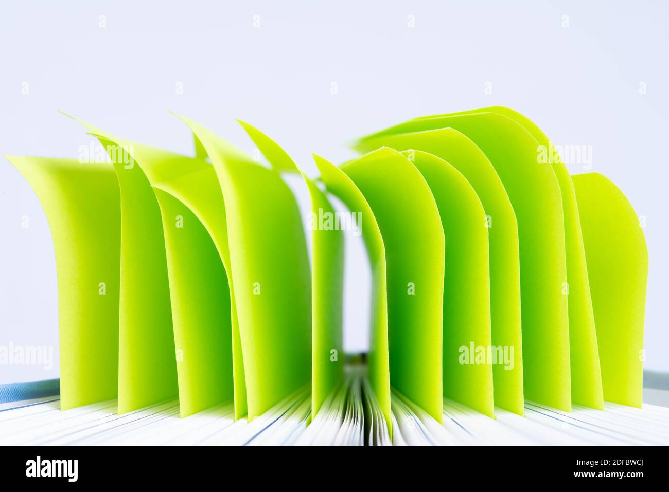 Open book with memo bookmark Stock Photo - Alamy