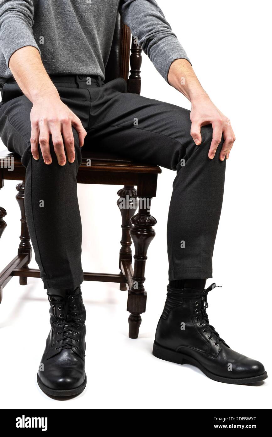 Half view young stressed man sitting on chair Isolated on white ...