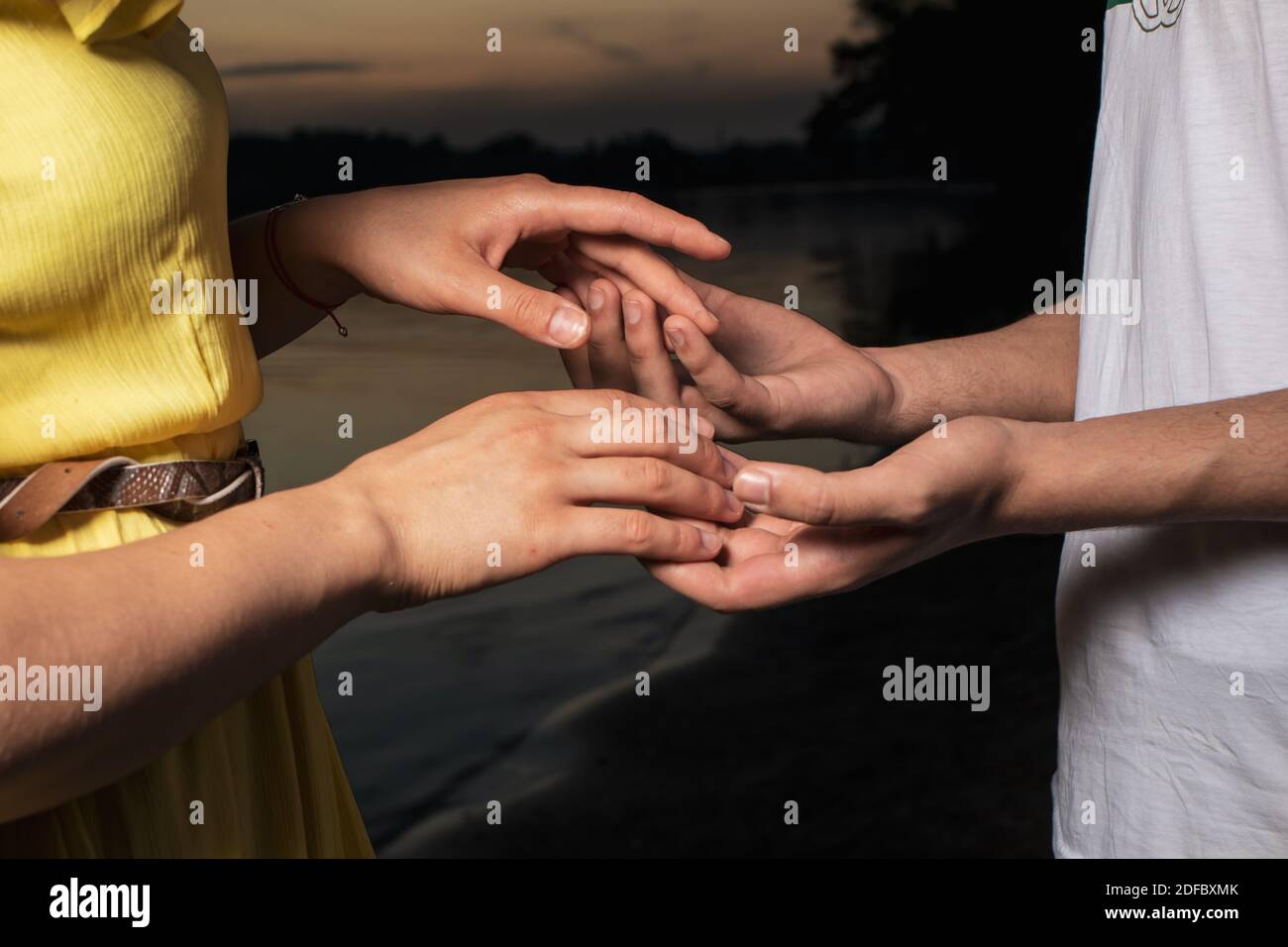 Men's and women's hands of lovers, two men gently hold hands. Love ...