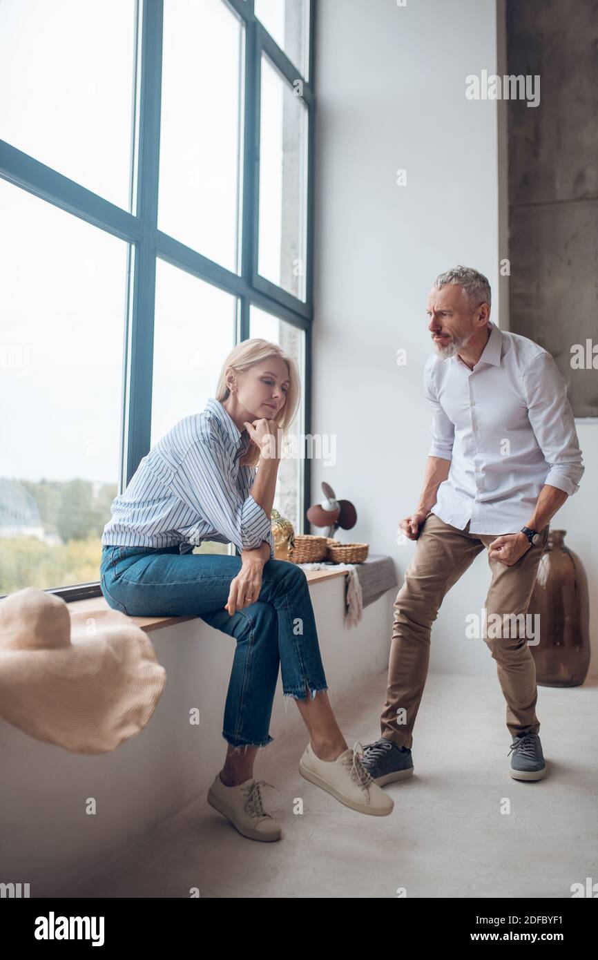 Grey-haired angry having an argument with his wife Stock Photo - Alamy