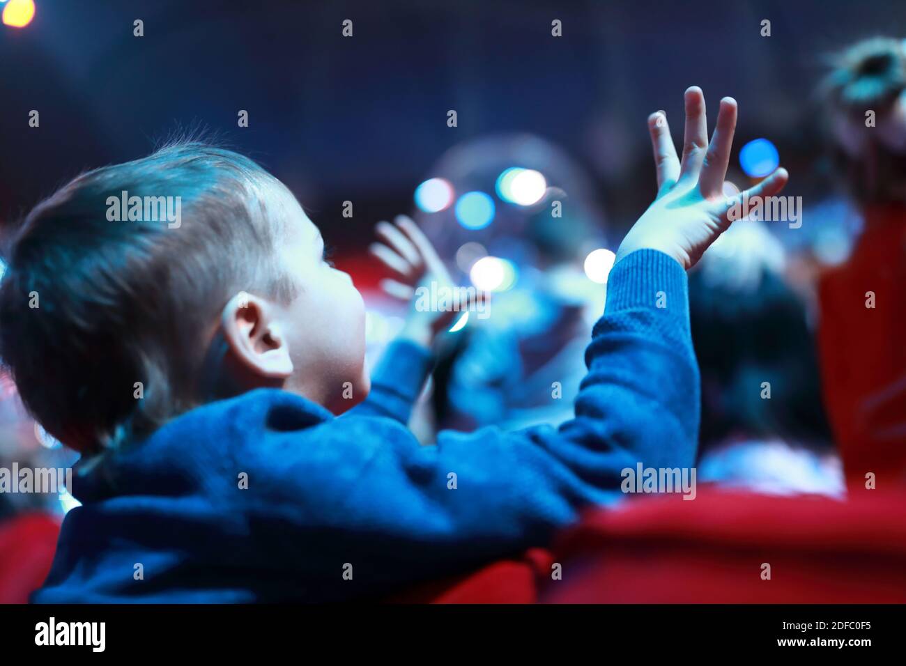 Sitting watching concert boy hi-res stock photography and images - Alamy