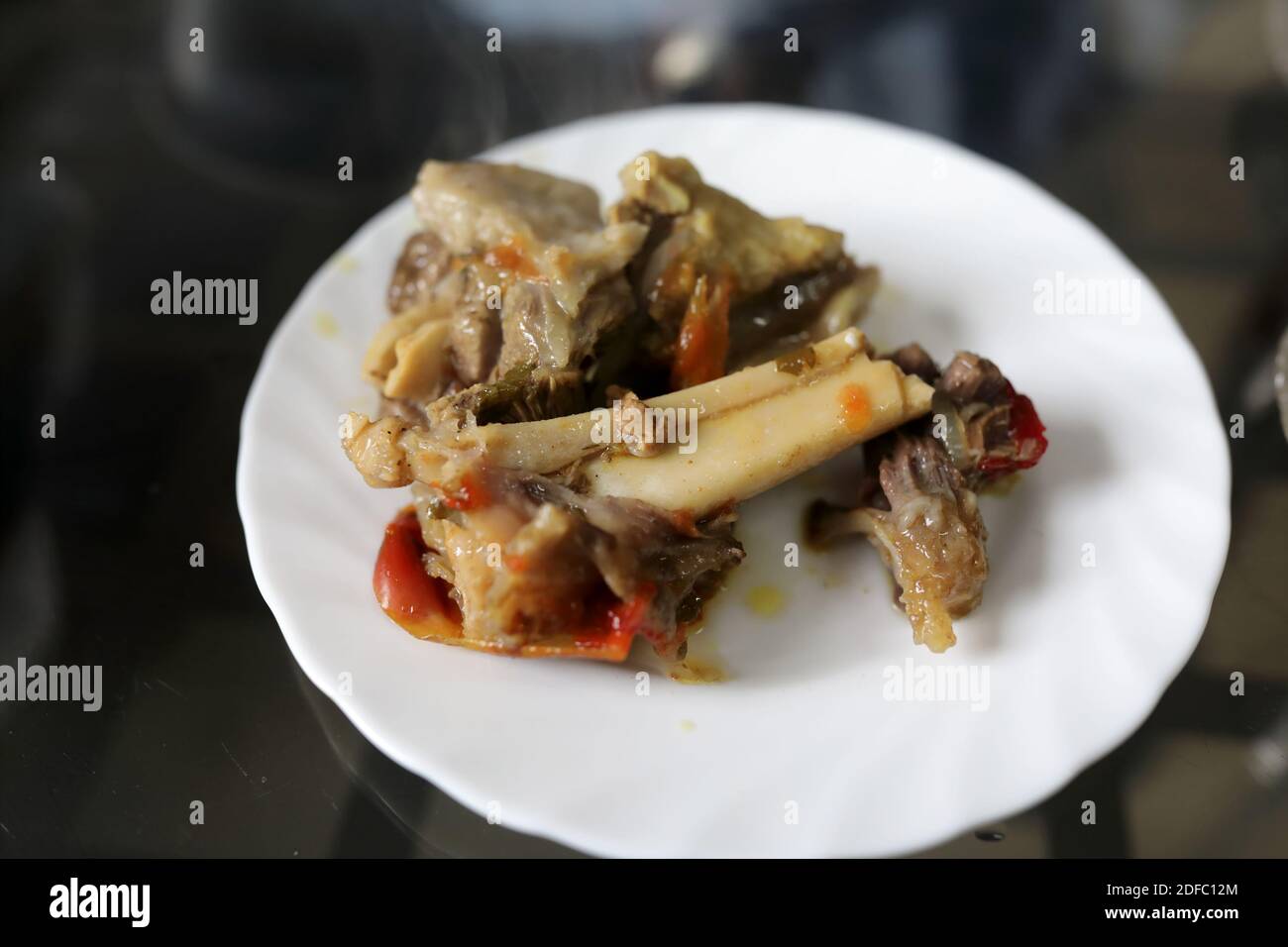 Bozbash Armenian meat on white plate in restaurant Stock Photo - Alamy