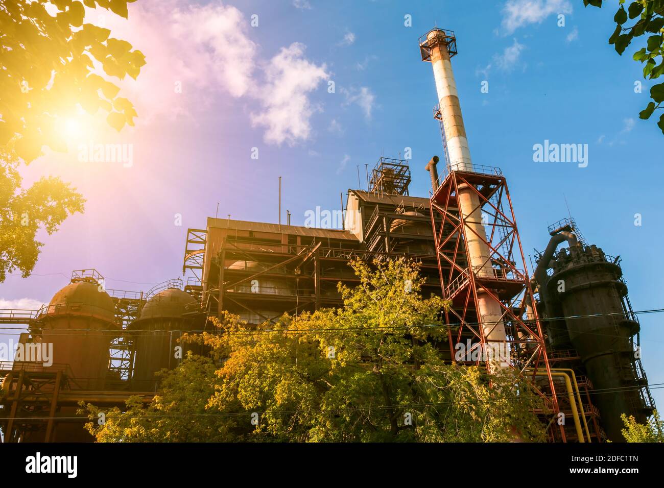Iron smelter factory in the rays of the evening sun Stock Photo - Alamy