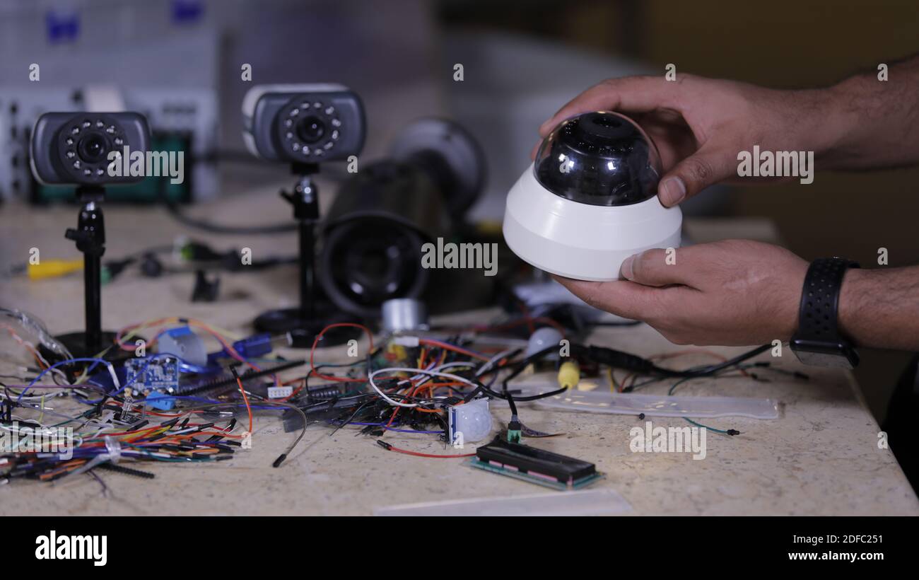 A man repairing CCTV camera in the service center Stock Photo - Alamy