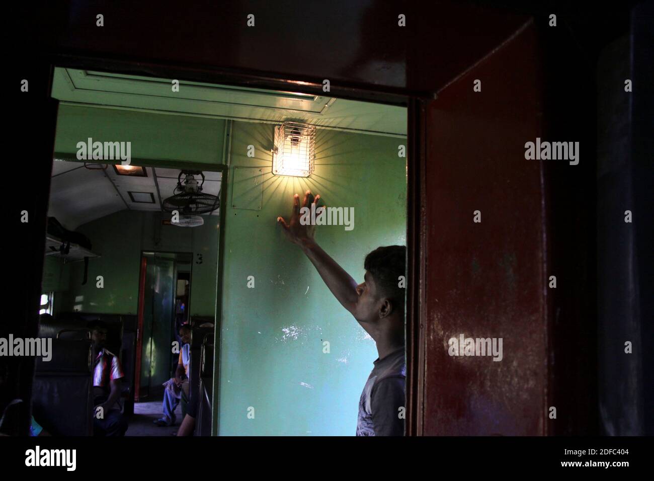 Sri Lanka, man watching the light on a train Stock Photo - Alamy