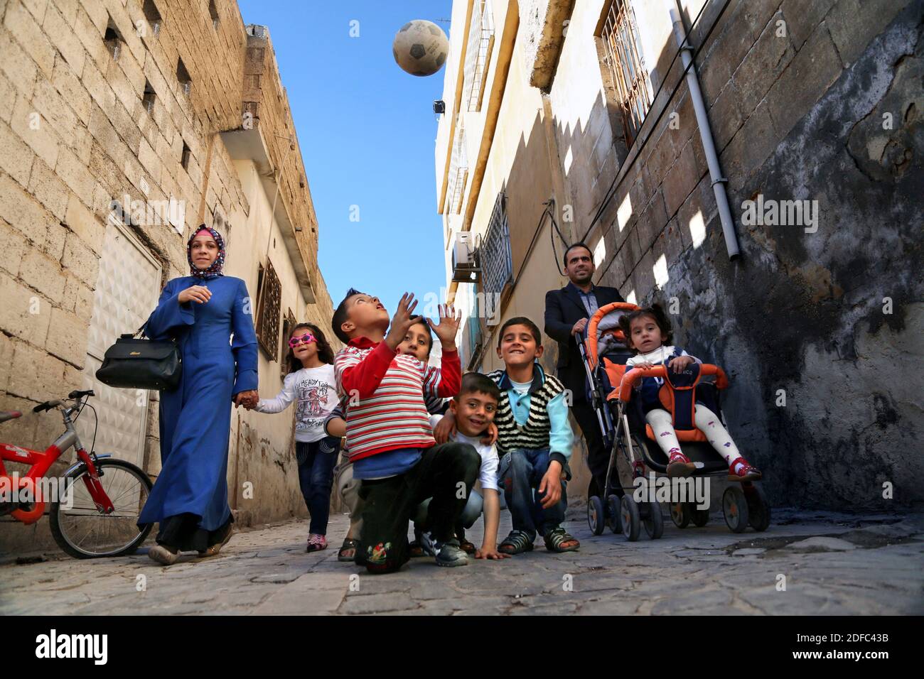 Turkey, child playing with a ball in the streets of Diyarbaklir Stock ...