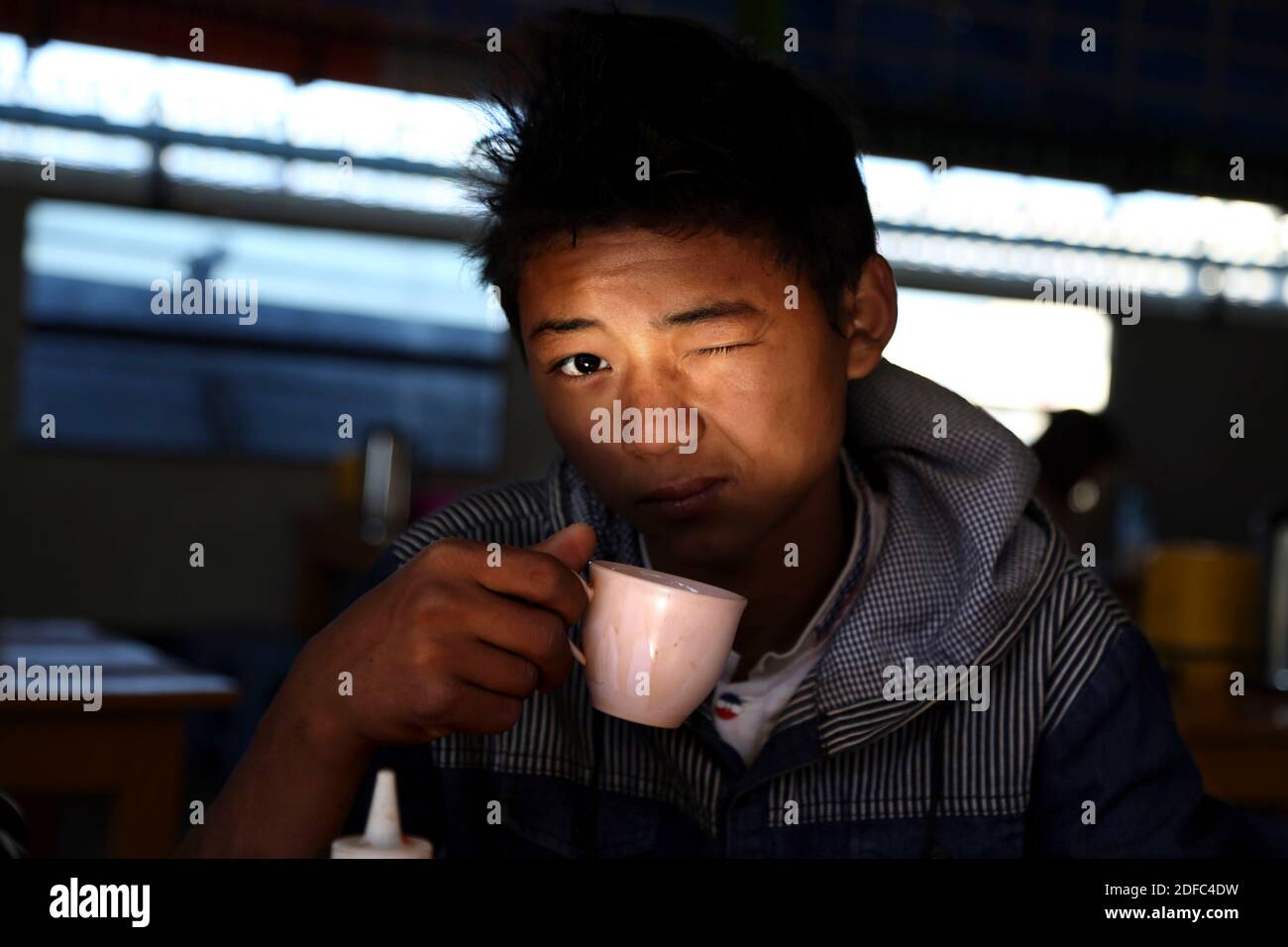 Myanmar (Burma), young boy drinking tea in Rangoon Stock Photo - Alamy