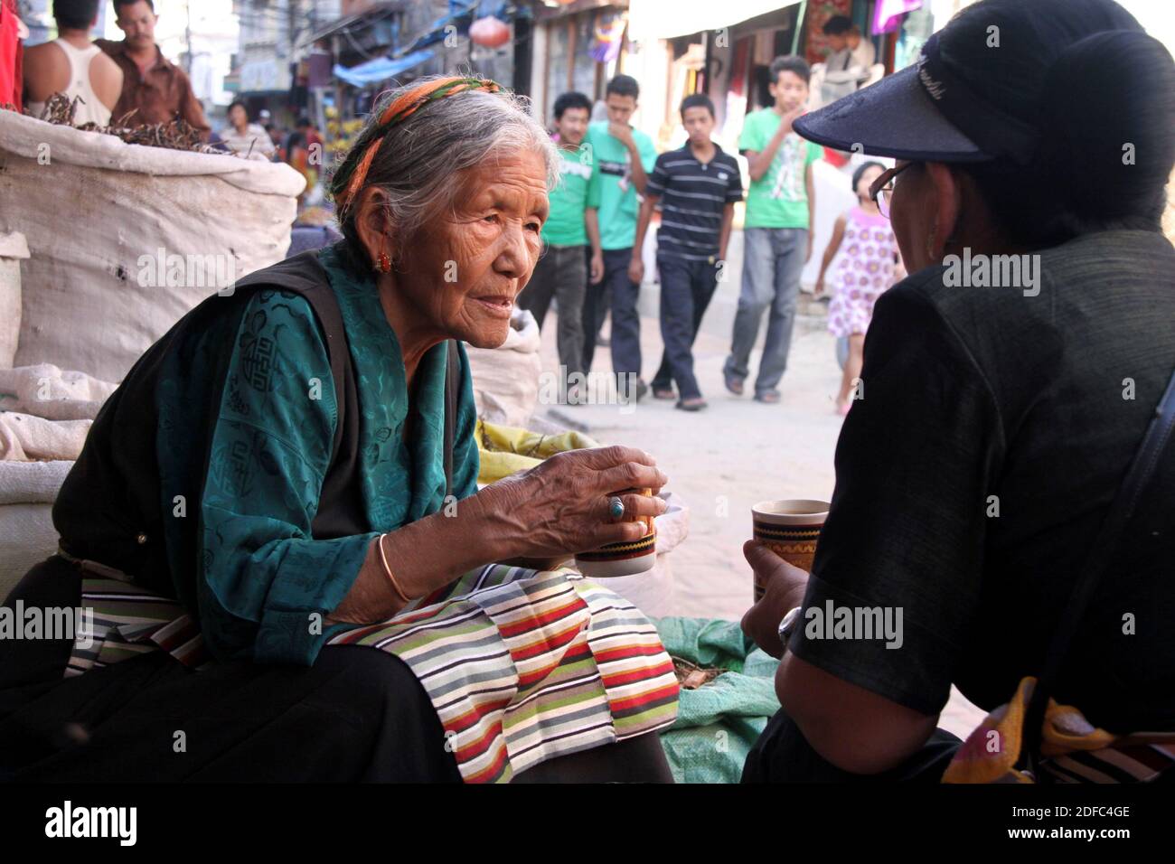 Nepal, two Newar women talk and drink tea in Boudhanath Stock Photo - Alamy
