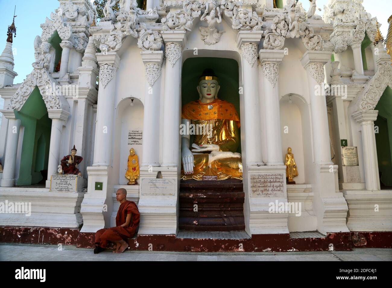 Myanmar (Burma), Rangoon, Buddhist monk meditating in Shwedagon pagoda ...