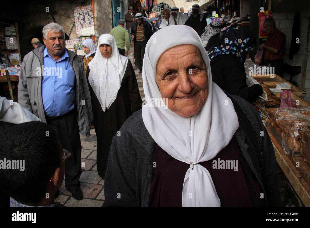 Israel, Old City of Jerusalem, old Arab woman in the crowd at the ...