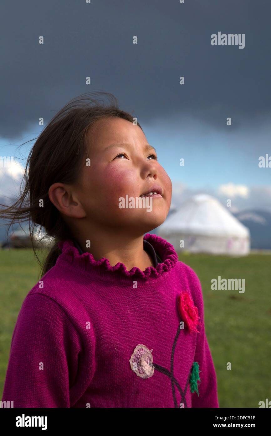 Kyrgyzstan, Silk Road, portrait of a young girl near Song Kol lake ...