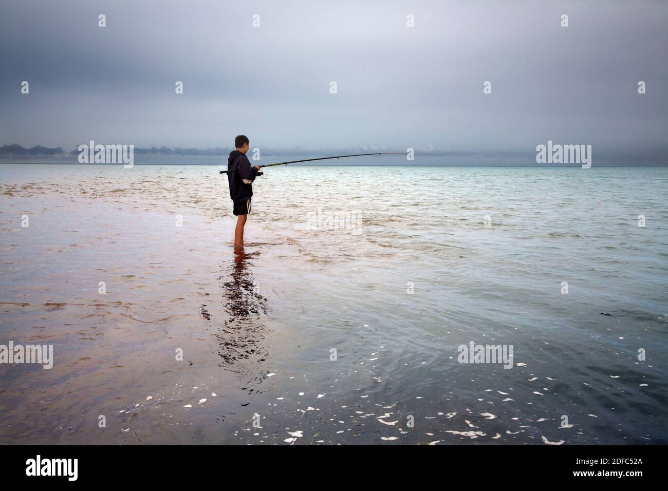 Kyrgyzstan, nomadic children fishing in Issyk-Kul lake Stock Photo - Alamy