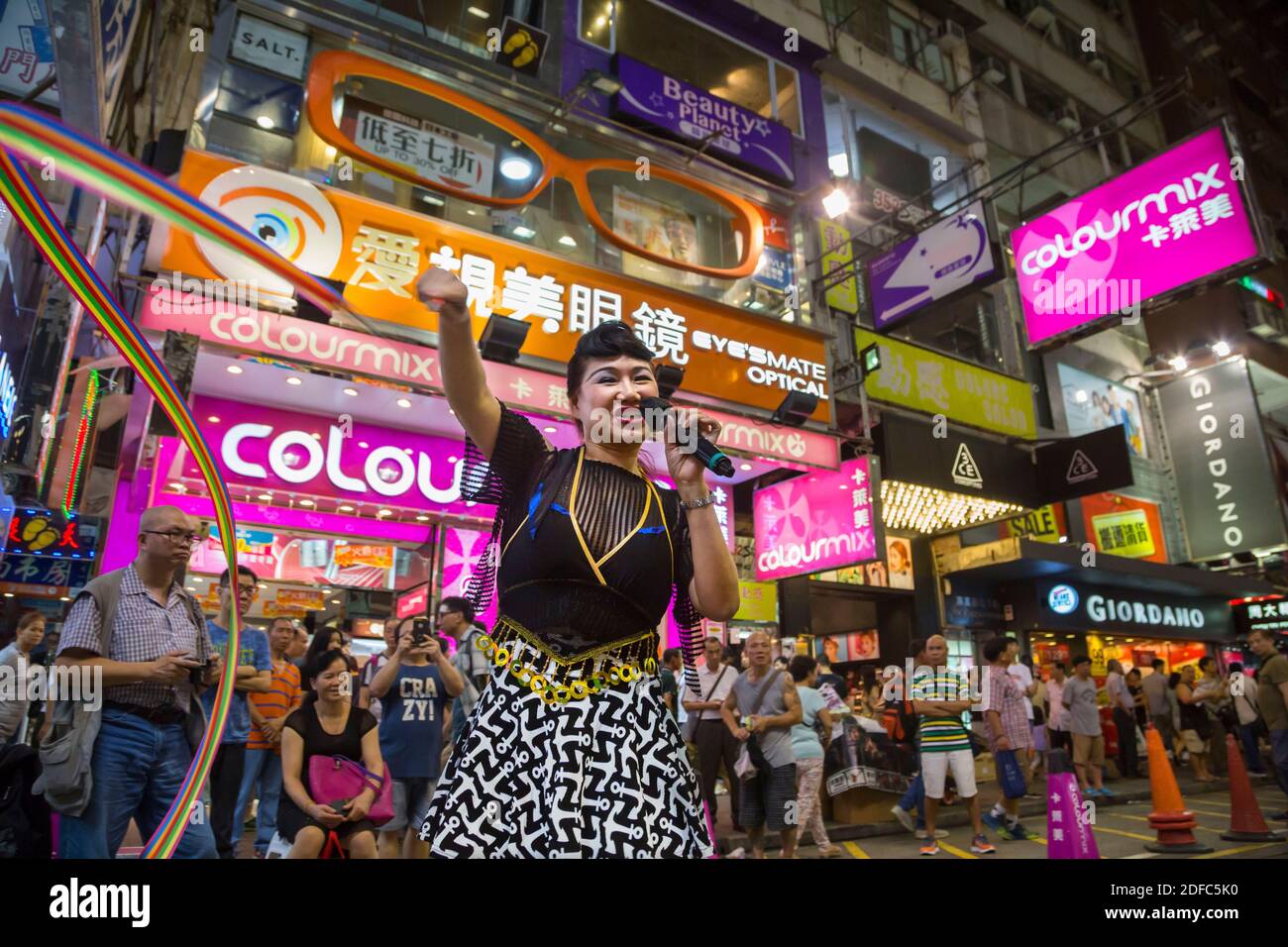 Hong Kong, crowd during live performance in the streets of Mong Kok on ...