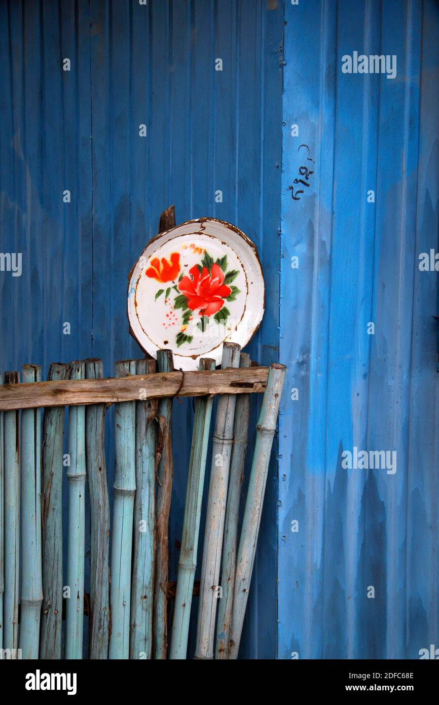 Ethiopia, Harar, plate for food in front of blue wall Stock Photo - Alamy
