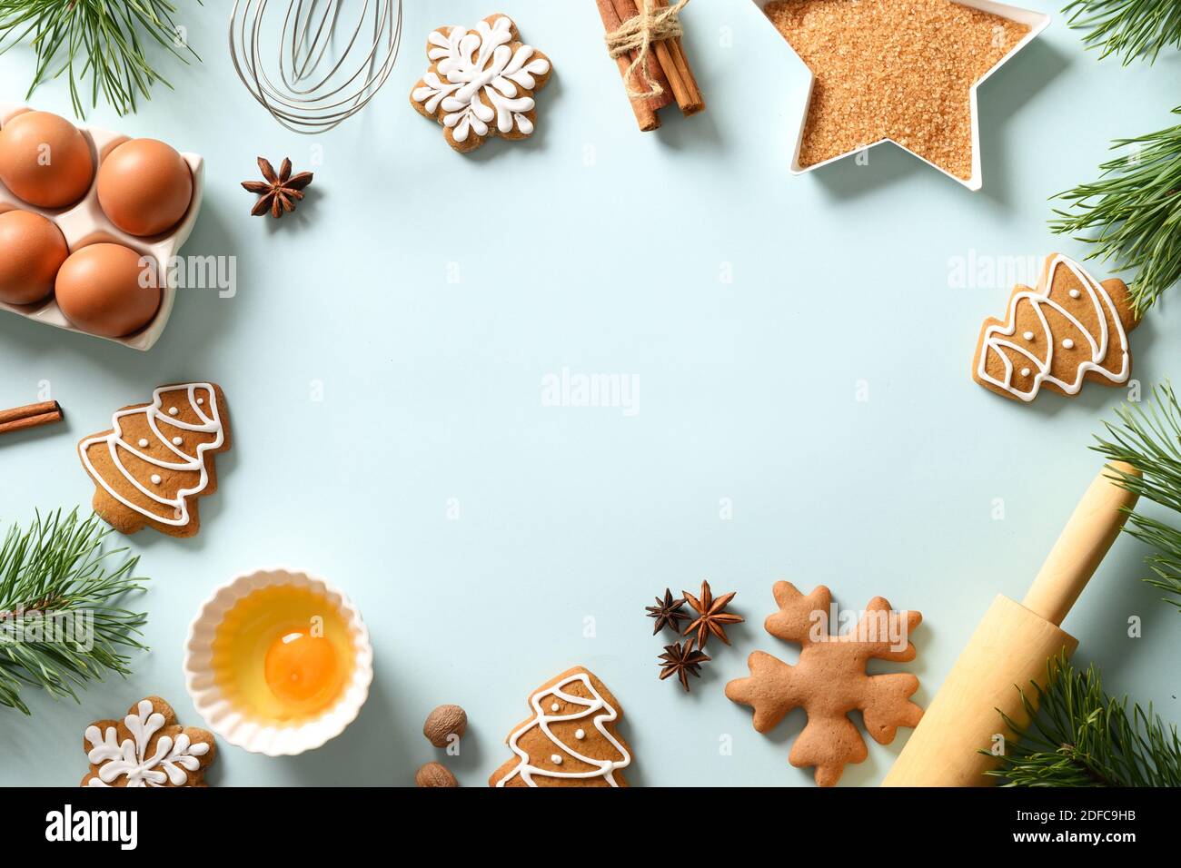 Christmas baking background with cookies and ingredients on blue ...