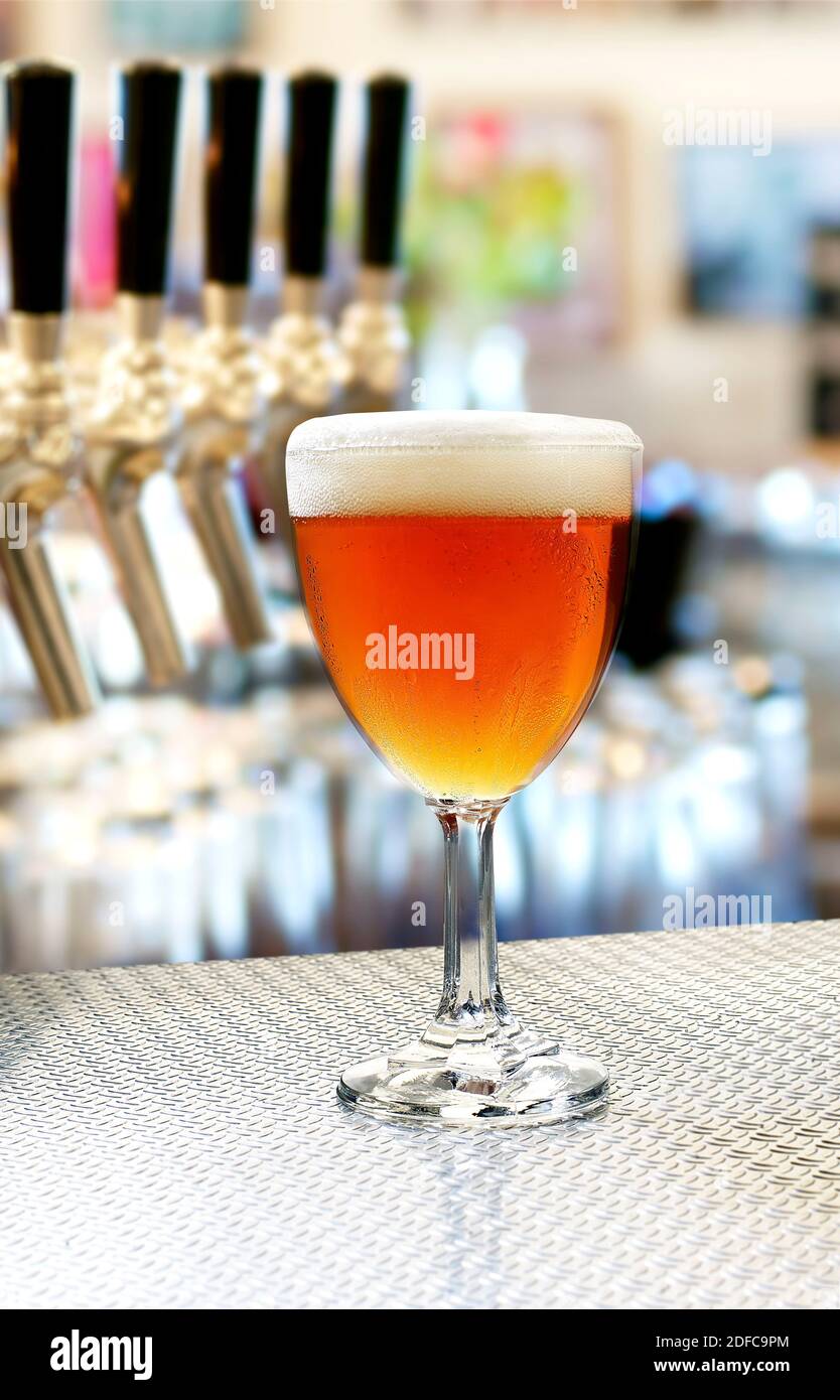 Glass of amber abbey beer Stock Photo - Alamy