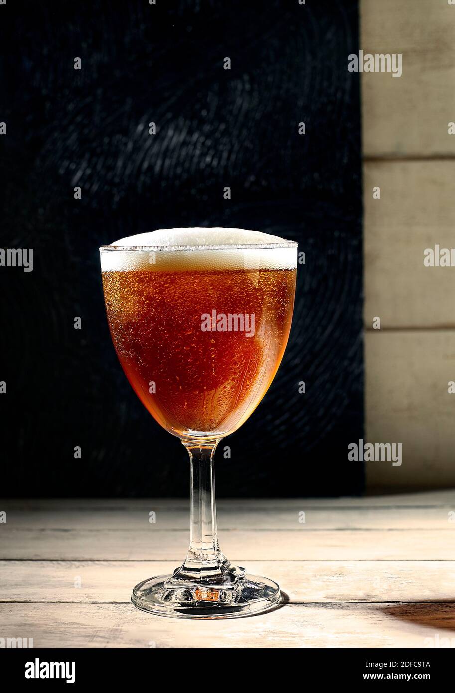Glass of amber abbey beer Stock Photo - Alamy