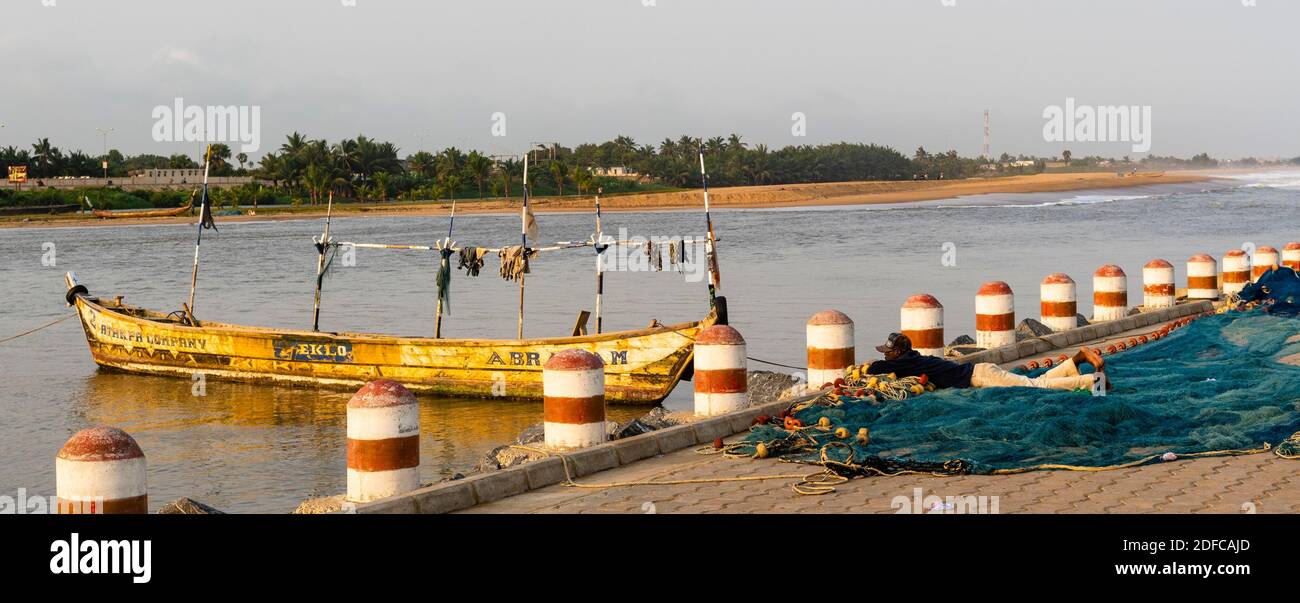 Togo, Aneho, fishing harbour, fisherman sleeping on his nets Stock ...
