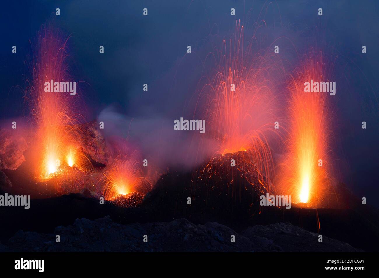 Stromboli volcano during strong eruption to sunrise with smoke Stock ...