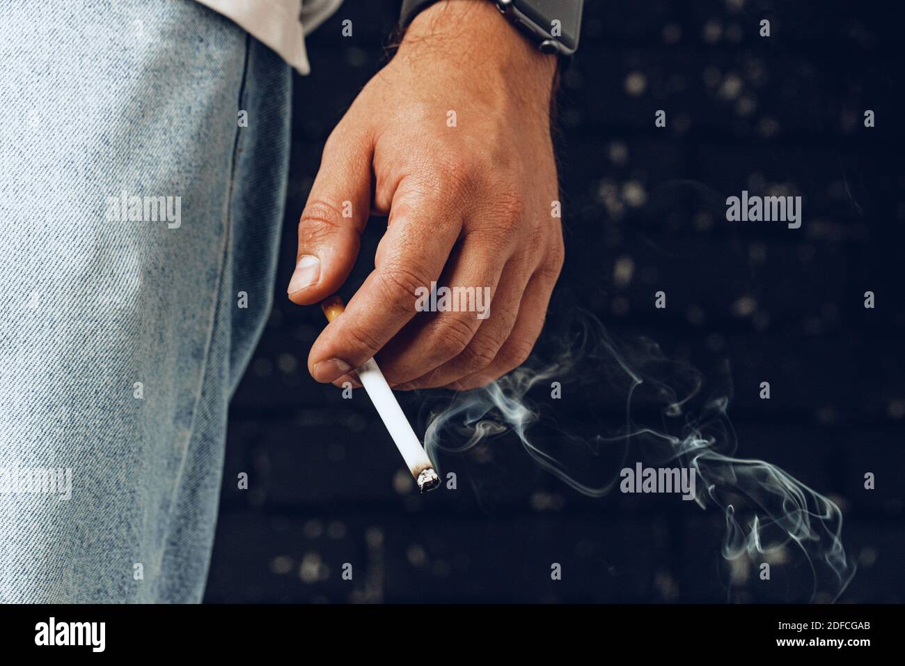 Holding Lit Cigarette High Resolution Stock Photography and Images - Alamy