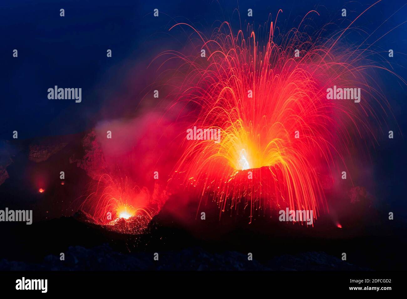 Stromboli volcano during strong eruption to sunrise with smoke Stock ...