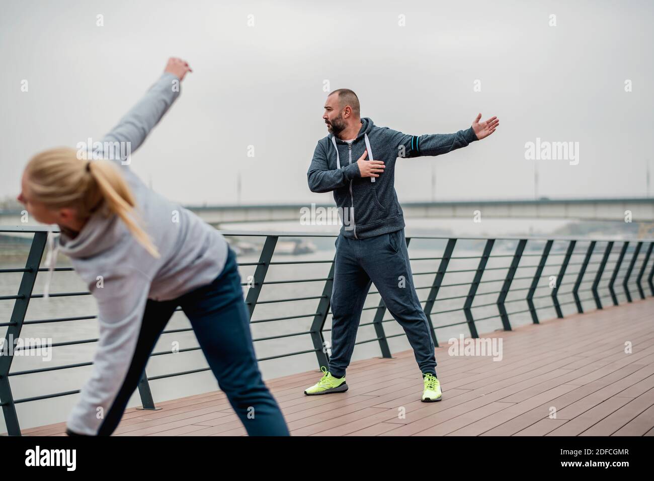 Group of friends doing fitness exercise outdoor Stock Photo - Alamy