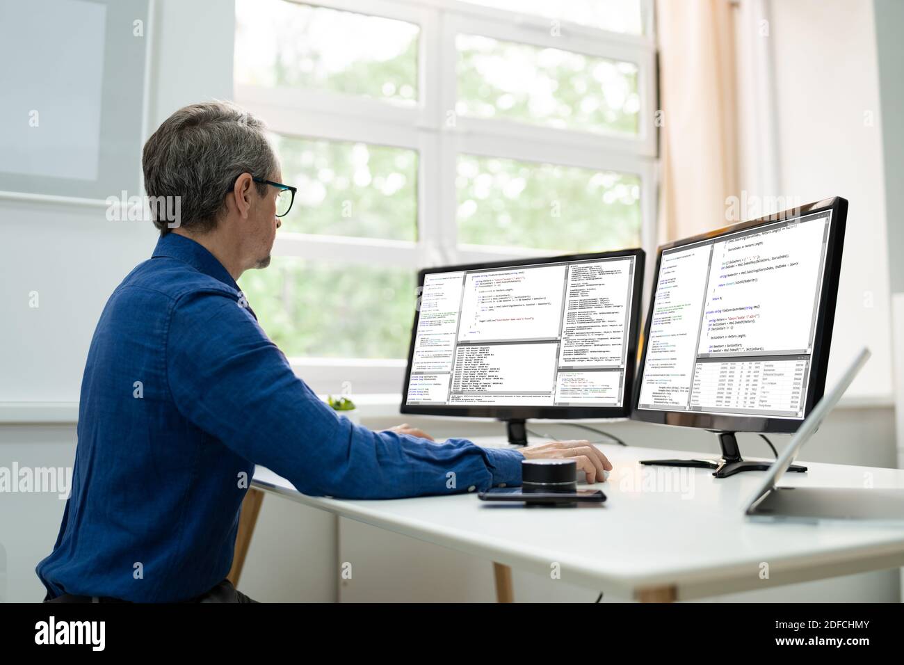 Work From Home On Multiple Computer Screen Stock Photo - Alamy