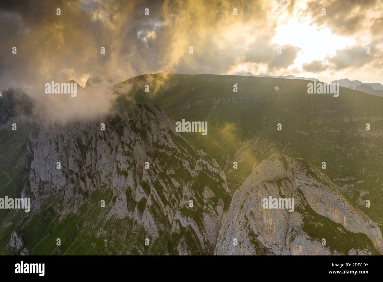 Foggy sunset over the rocky peaks of Santis and Saxer Lucke, aerial ...