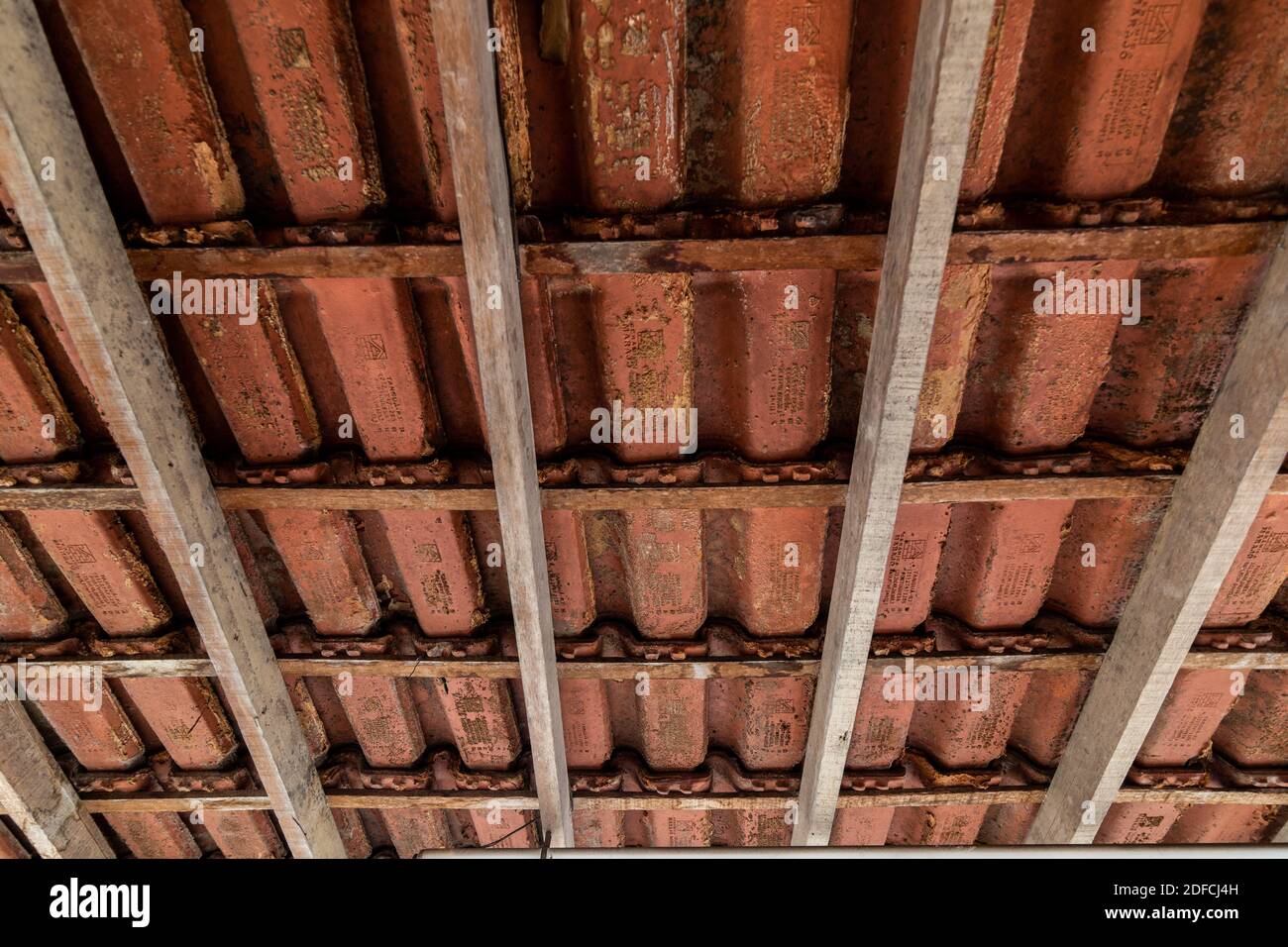 A closeup of a rusty iron ceiling reinforced with wooden planks Stock ...