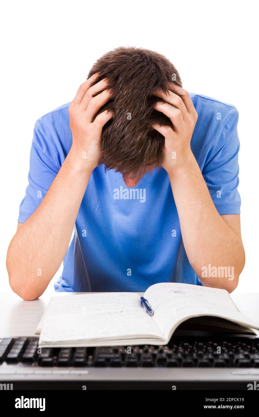 Sad Young Man with a Book and a Computer Keyboard on the White ...
