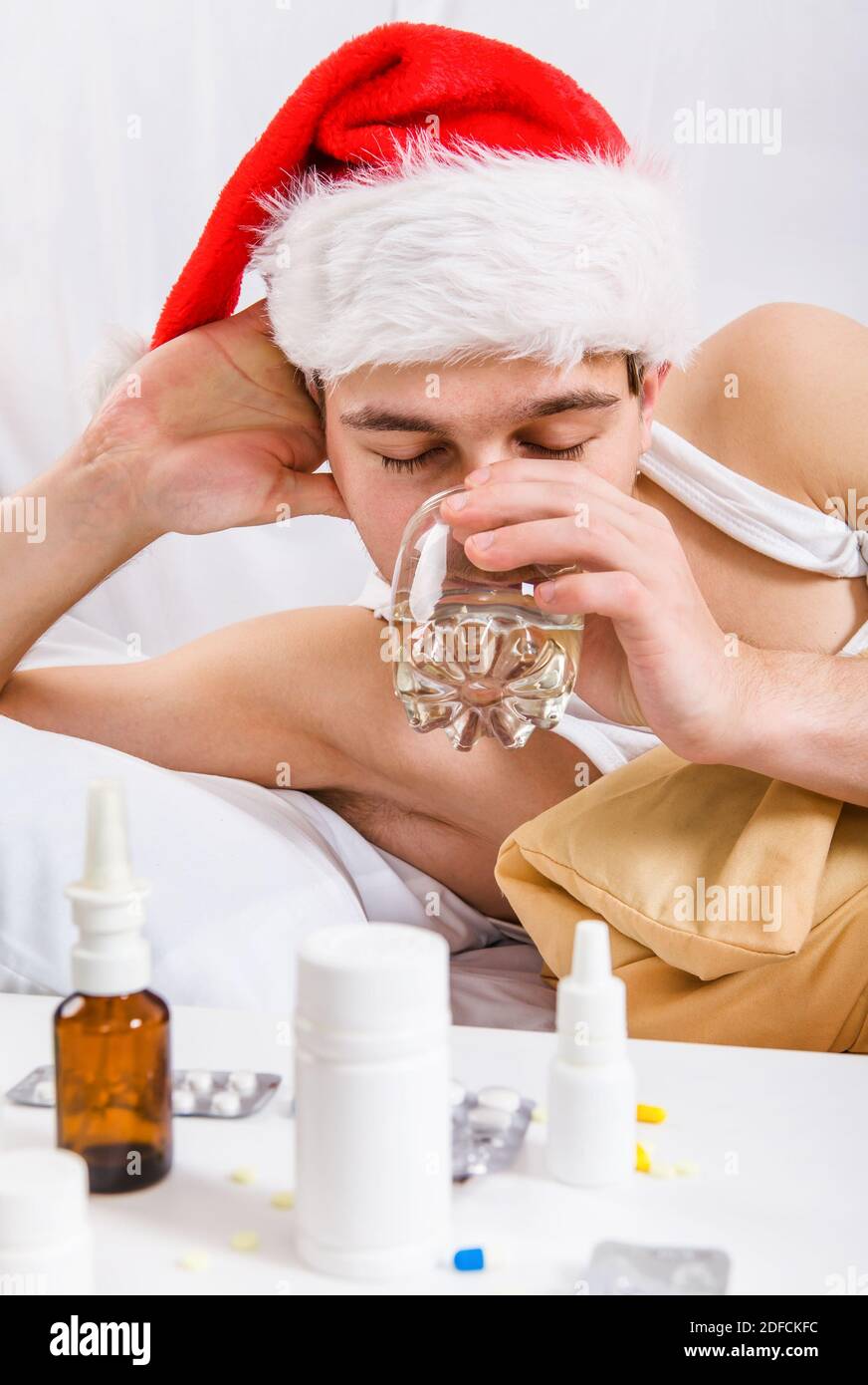 Sick Man in Santa Hat drink a Water in the Bed at the Home Stock Photo ...