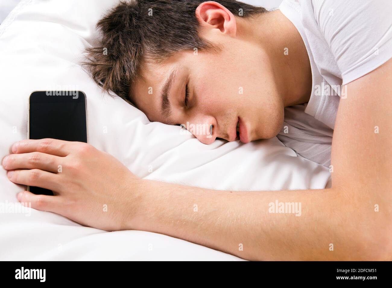 Lying tired phone hi-res stock photography and images - Alamy