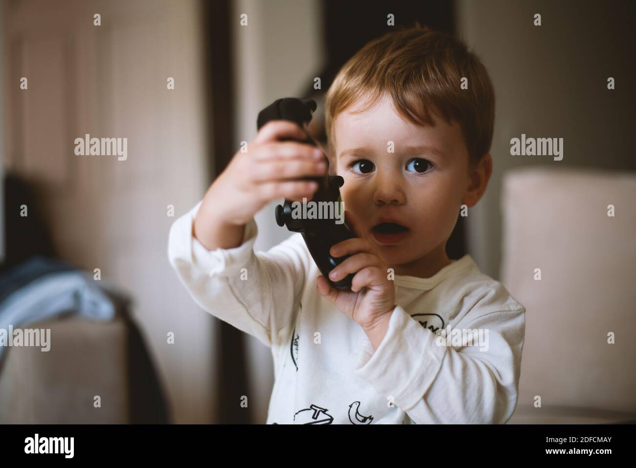 Boy playing on video computer game controller Stock Photo - Alamy