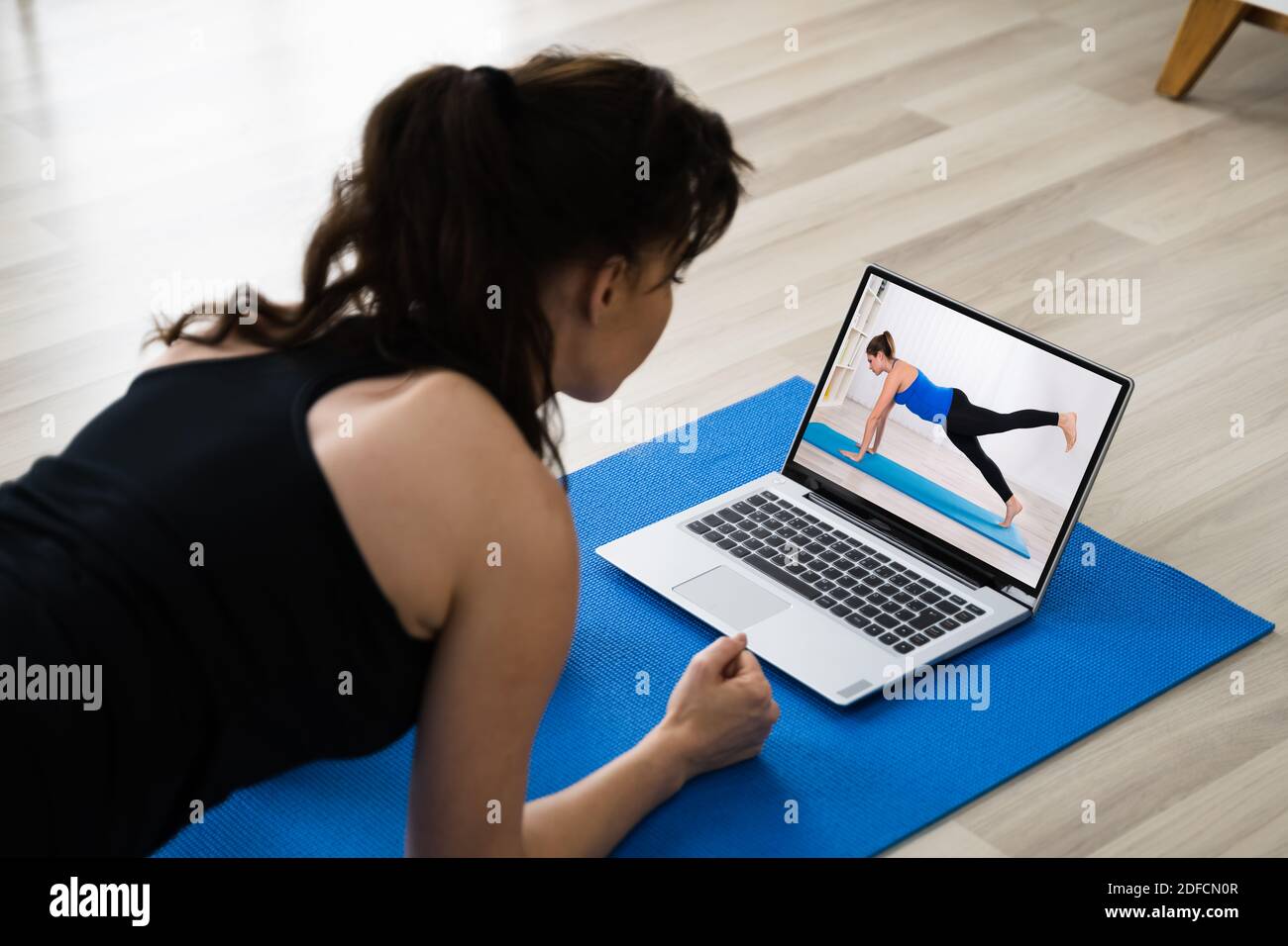Online Laptop Home Fitness Workout And Exercise Stock Photo - Alamy
