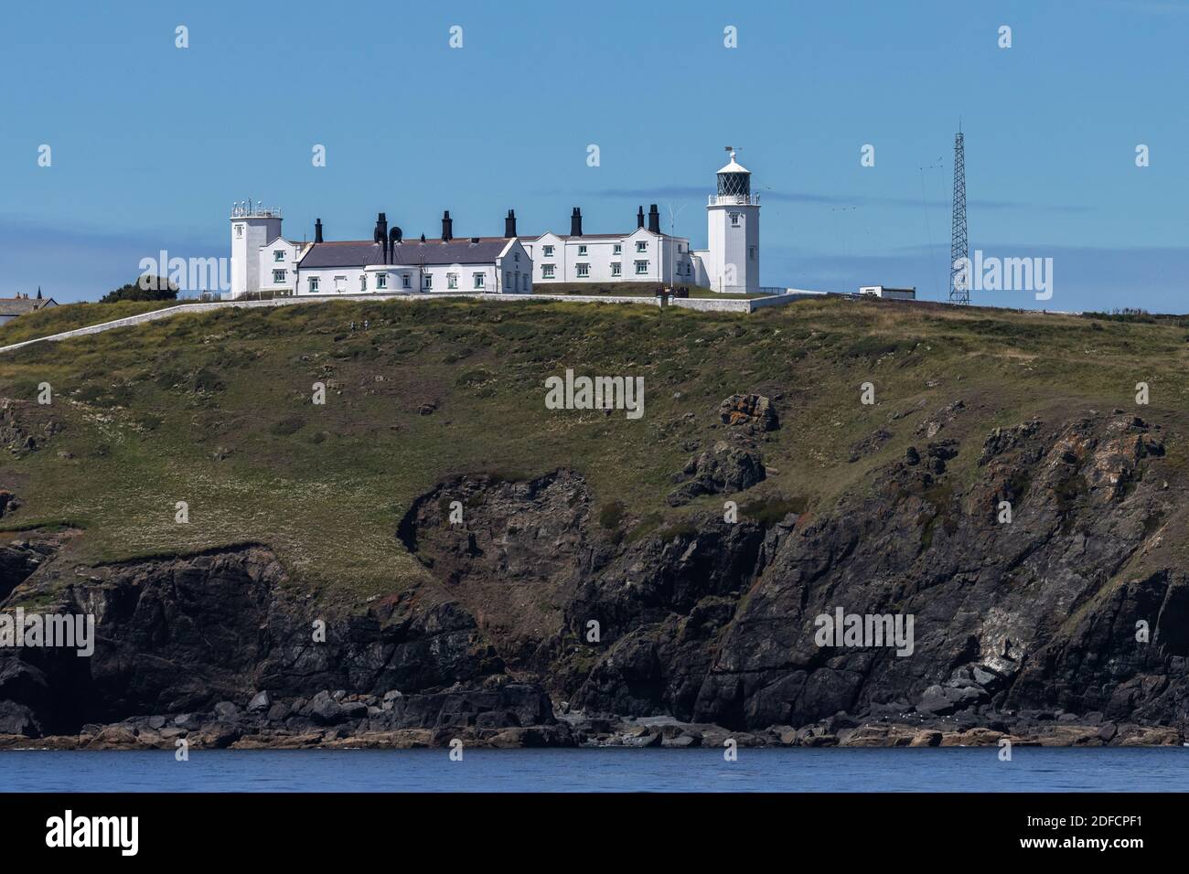 Lizard Point Lighthouse on a bright day, photo from the sea Stock Photo ...
