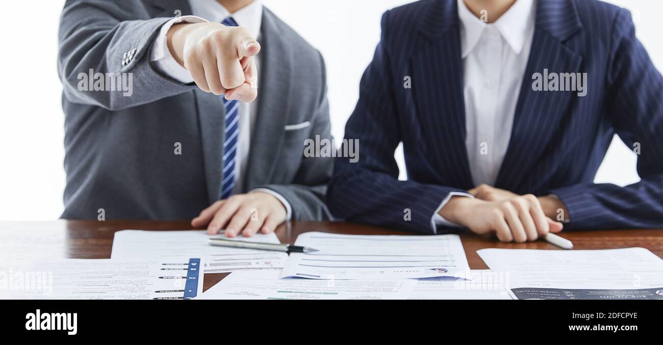 Two businessmen in elegant suits at a business meeting discussing a new ...