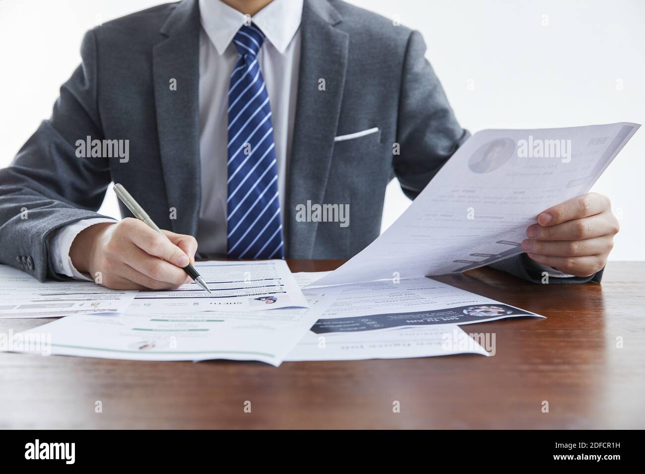 The businessman in elegant suit at a business meeting discussing ...