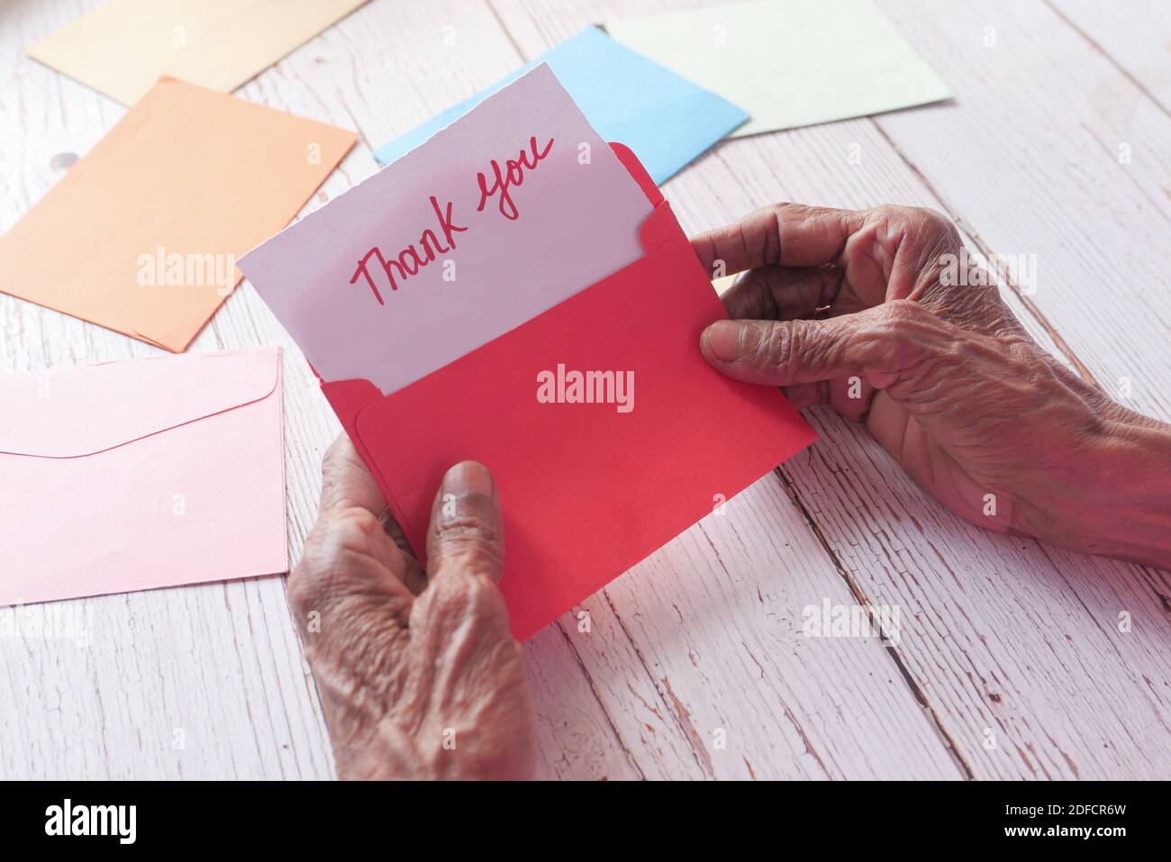 senior women's hand holding thank you letter , rear view Stock Photo ...