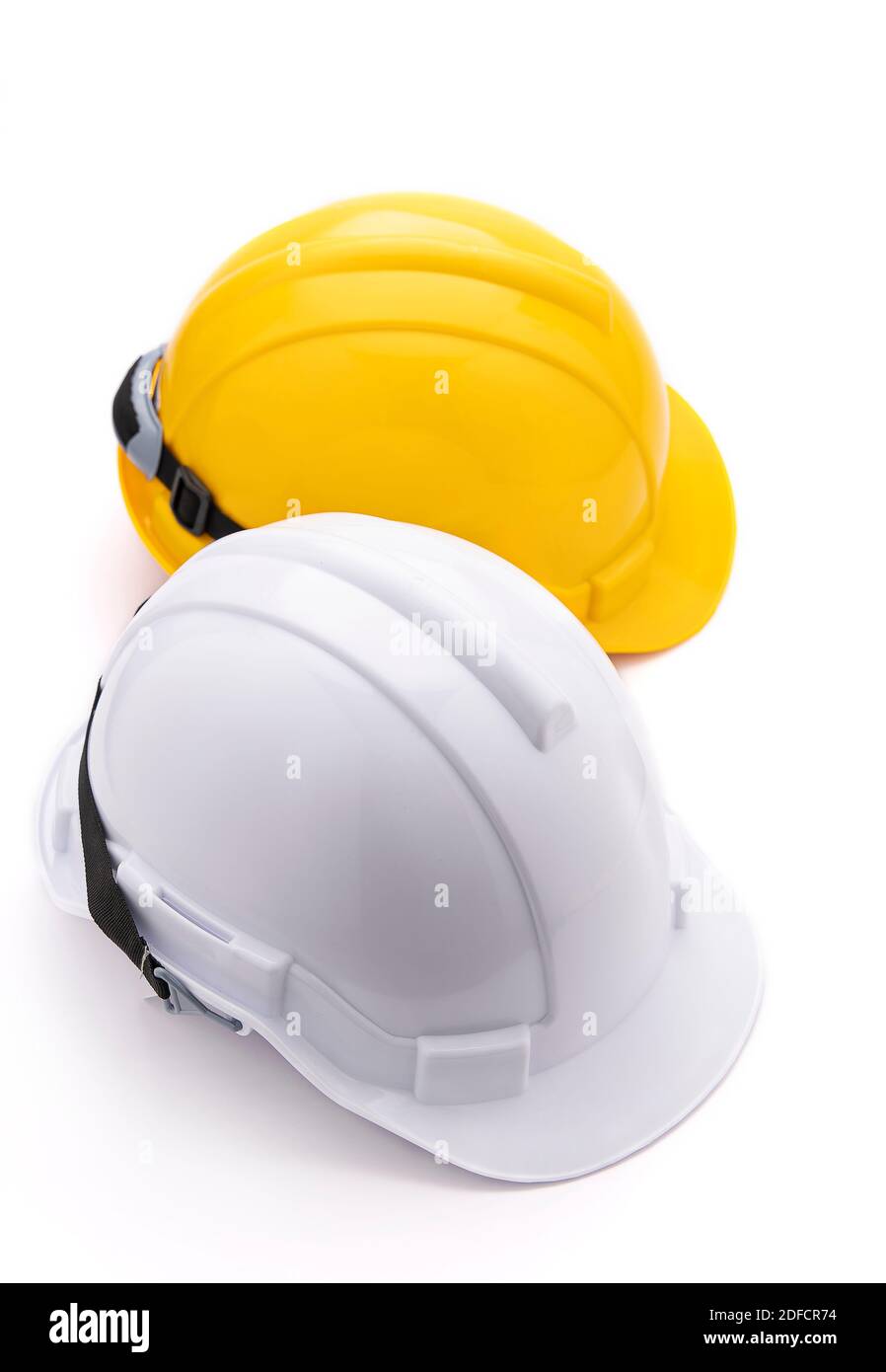 Close up white and yellow safety helmet isolated on white background ...