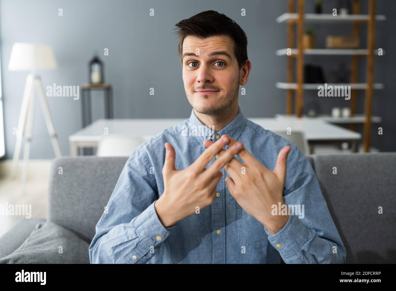 Adult Learning Sign Language For Deaf Disabled Stock Photo - Alamy