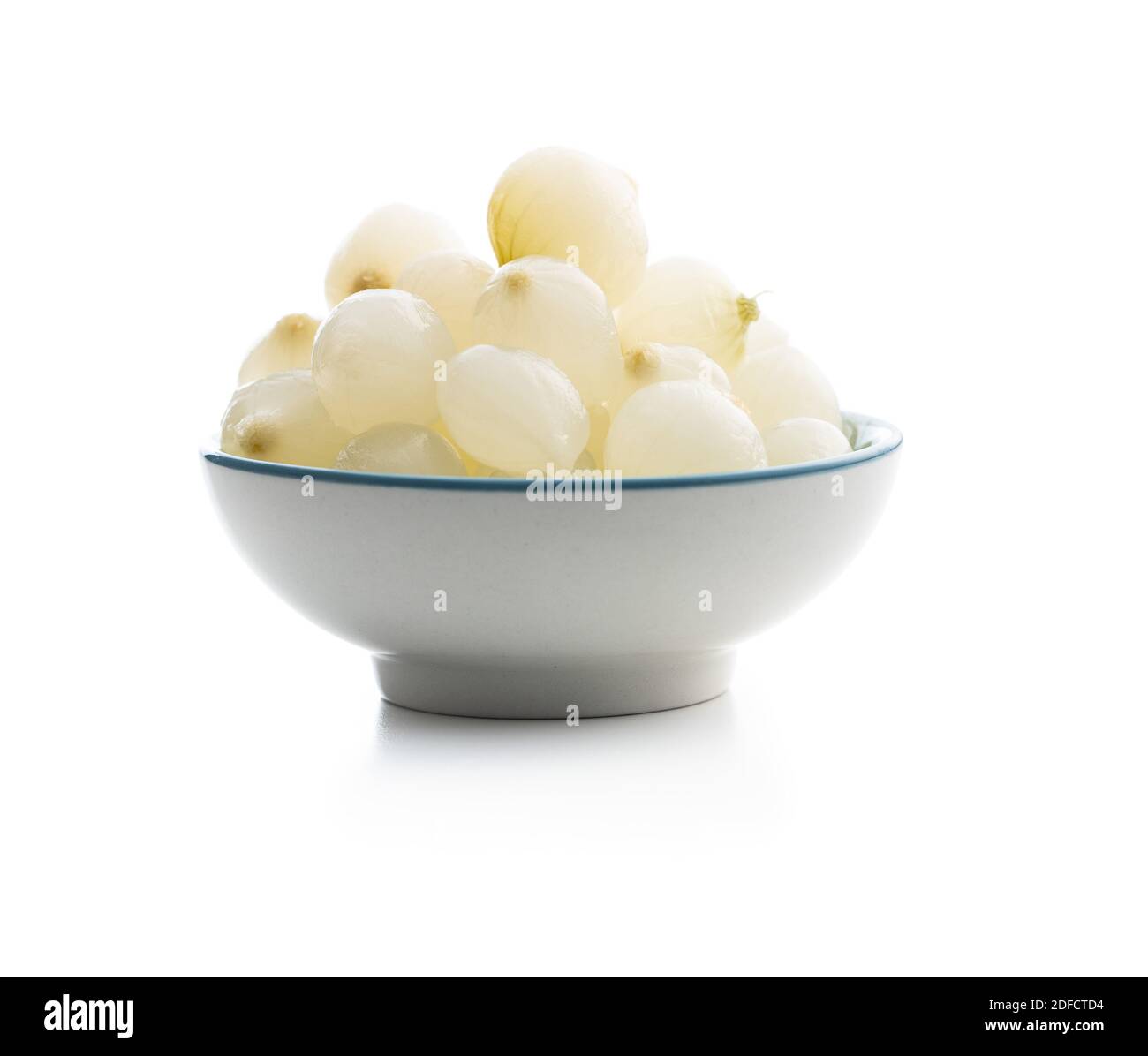Pickled mini baby onions in bowl isolated on white background Stock ...