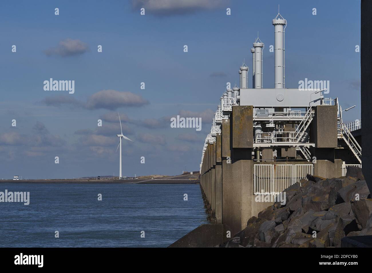A closeup view of storm barriers placed near the stones and the water ...