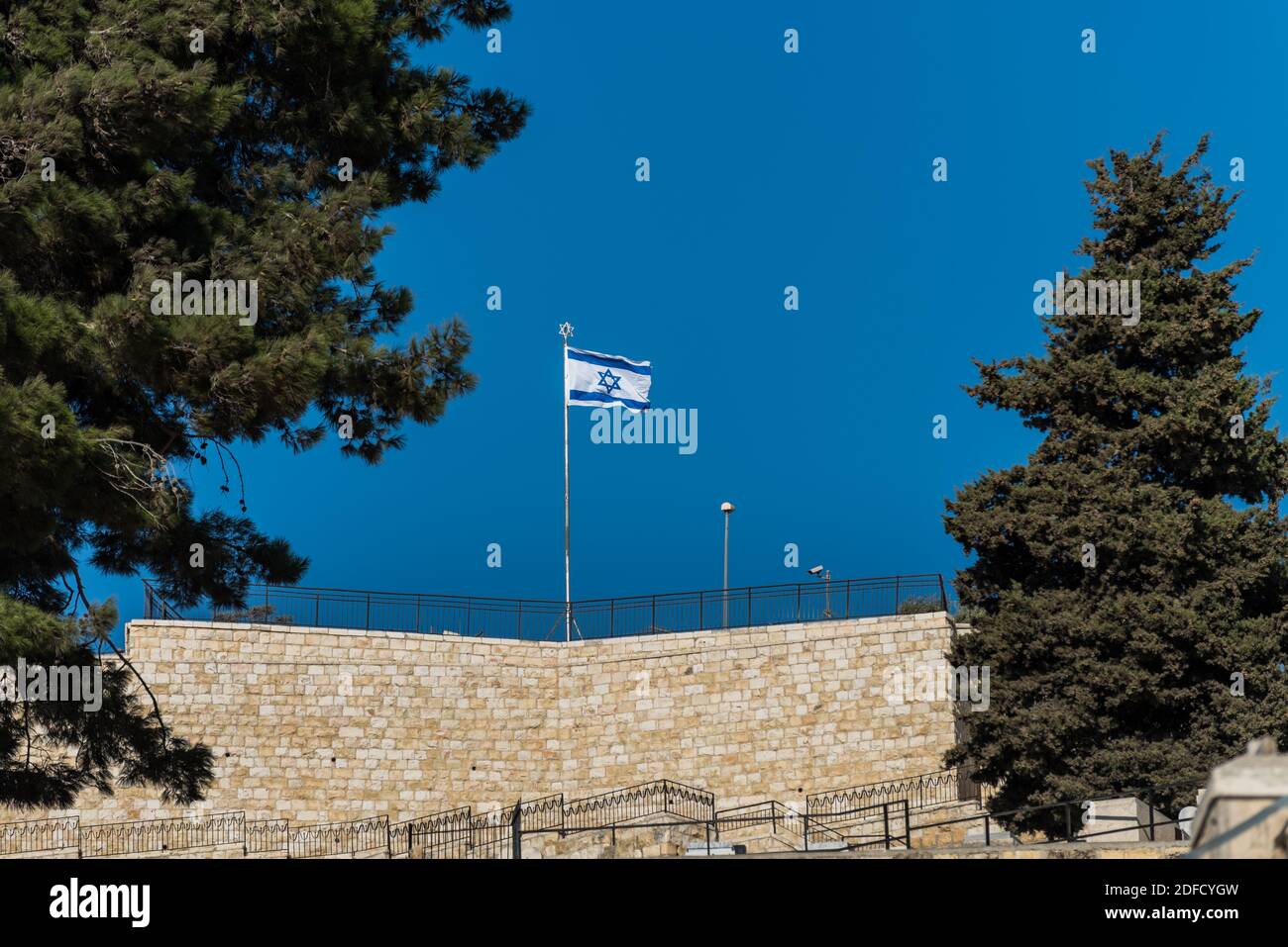 Israeli National flag waving on the view platform of Mount of Olive in ...