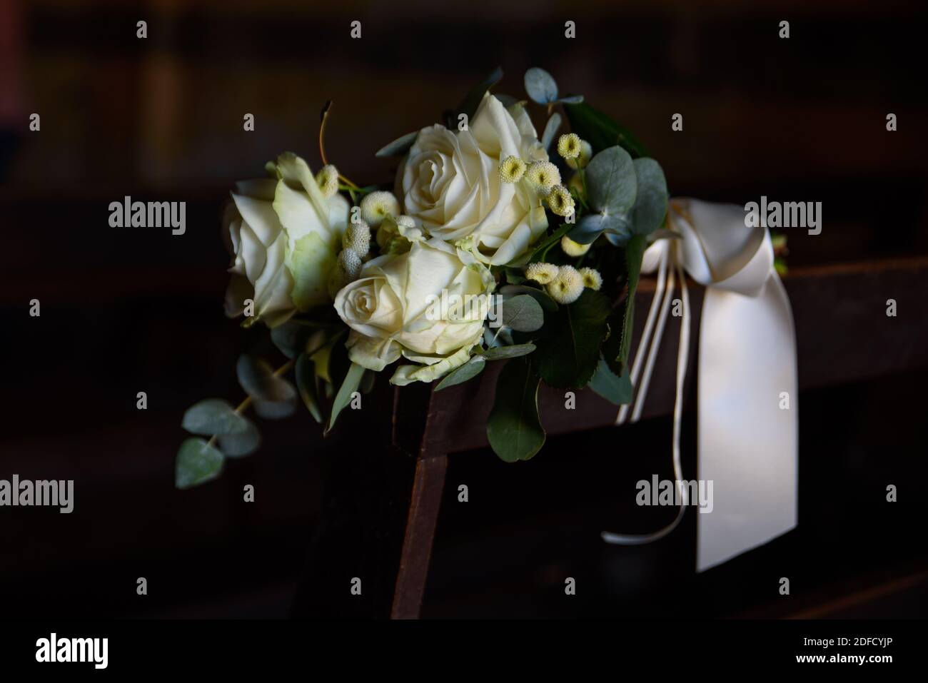 White wedding roses on a church pew Stock Photo - Alamy