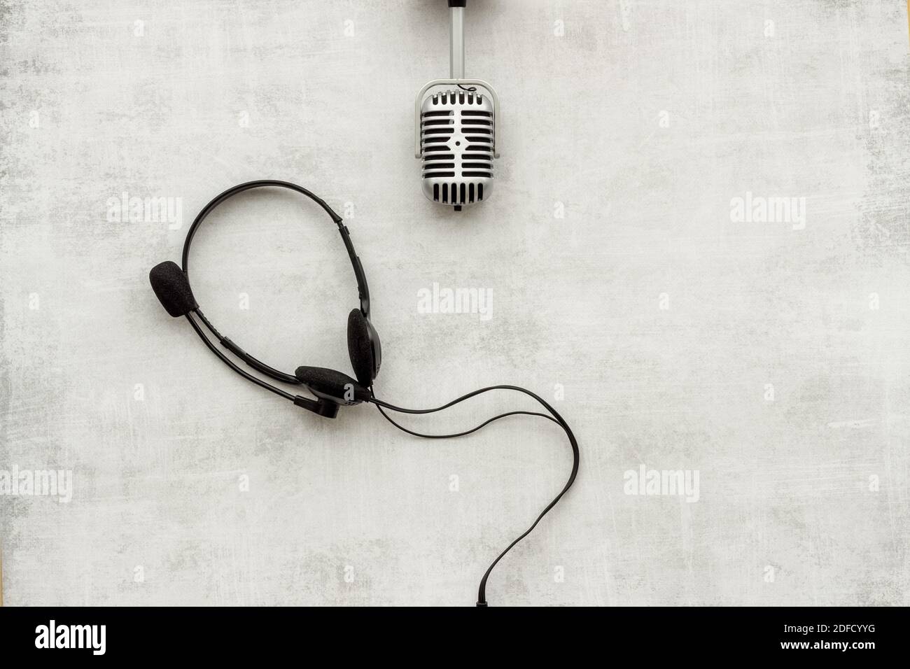 Podcast and streaming record. Microphone and headphones on table, top ...