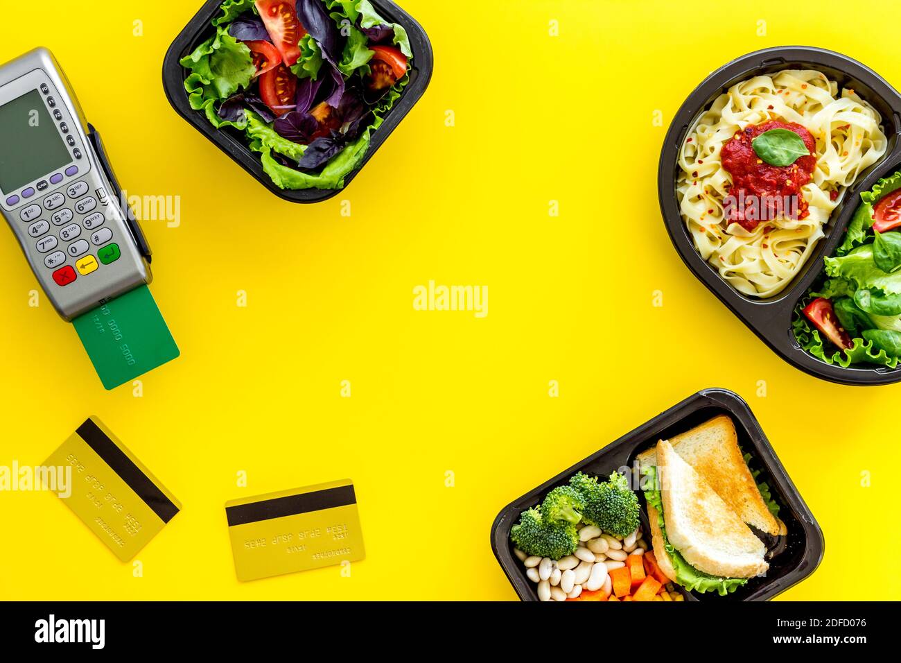Food delivery payment with terminal and lunch boxes with meal Stock ...