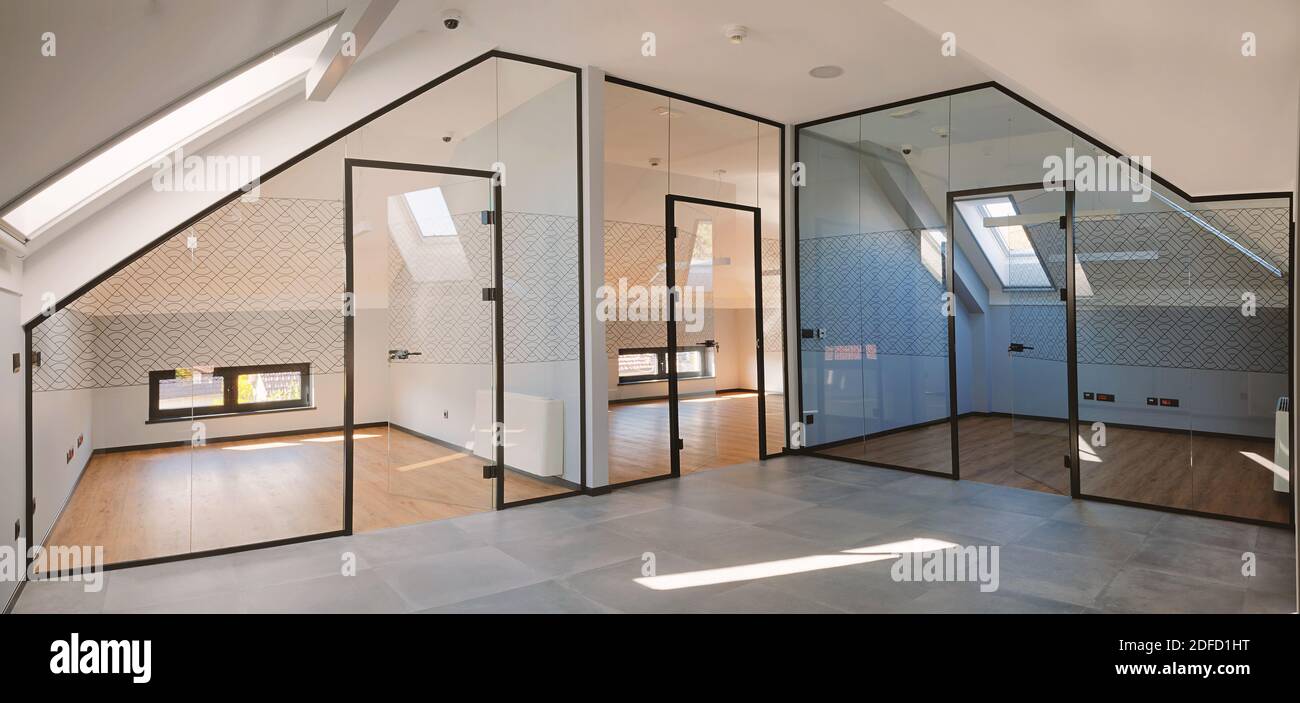Interior of modern offices, entry walls and doors made of glass, loft ...