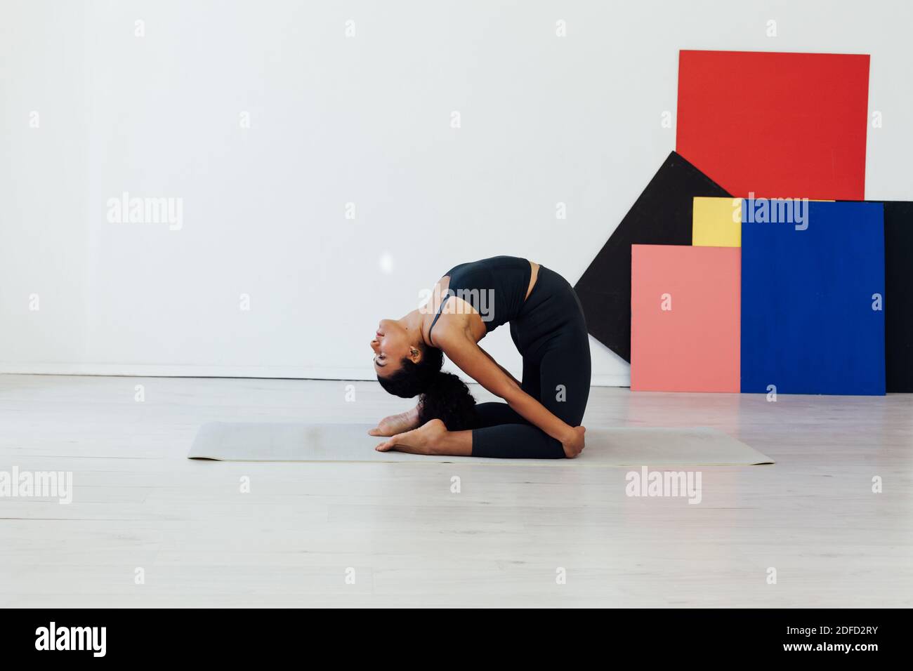 Beautiful flexible woman yoga asana gymnastics body flexibility Stock ...