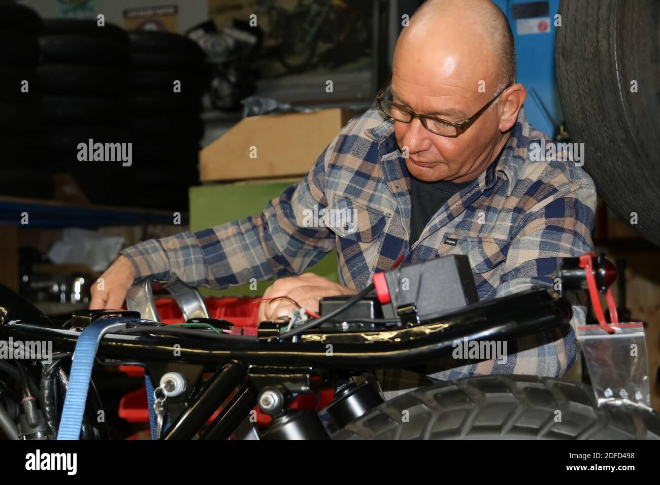 Mechanic working motorcycle workshop High Resolution Stock Photography ...