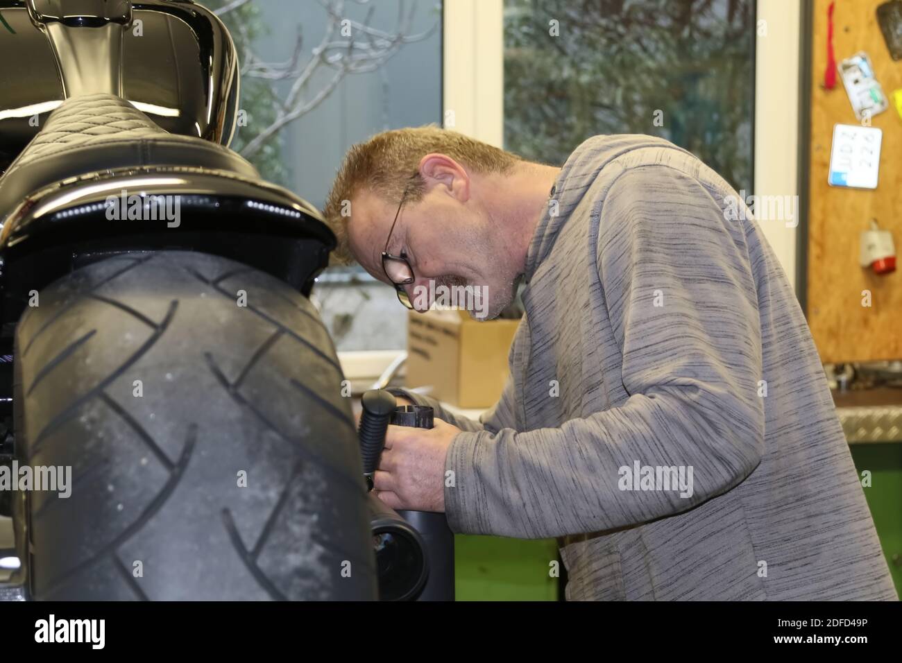 motorcycle mechanic at work Stock Photo - Alamy